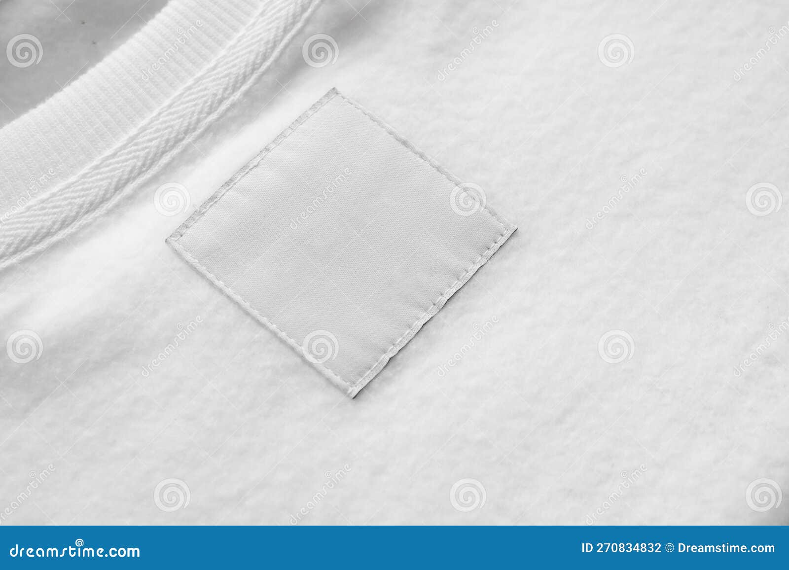 Blank White Laundry Care Clothes Label on Fabric Texture Background ...