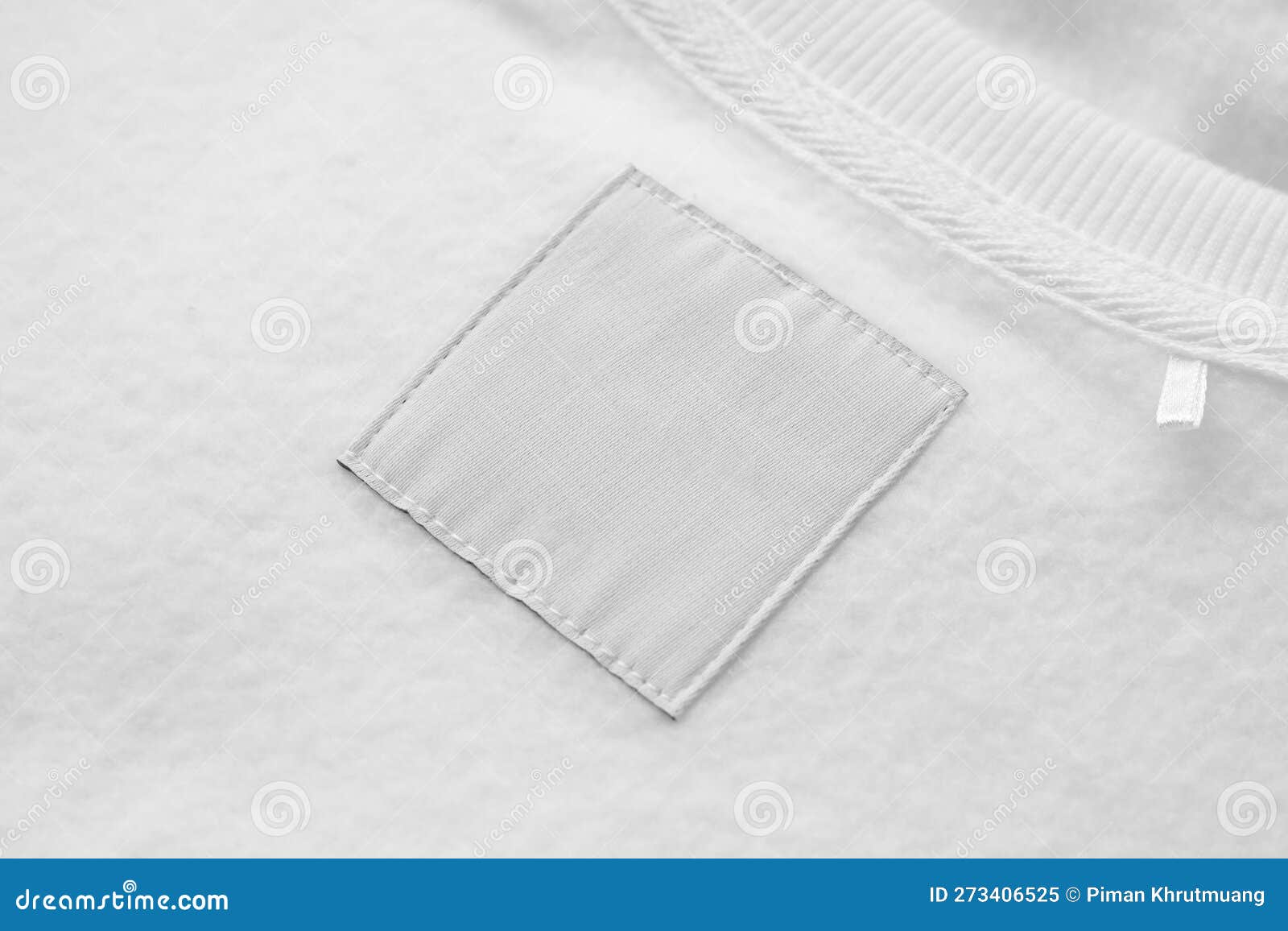 Blank White Laundry Care Clothes Label on Fabric Texture Background ...