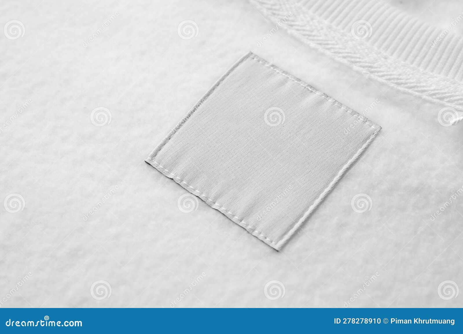 Blank White Laundry Care Clothes Label on Fabric Texture Stock Photo ...