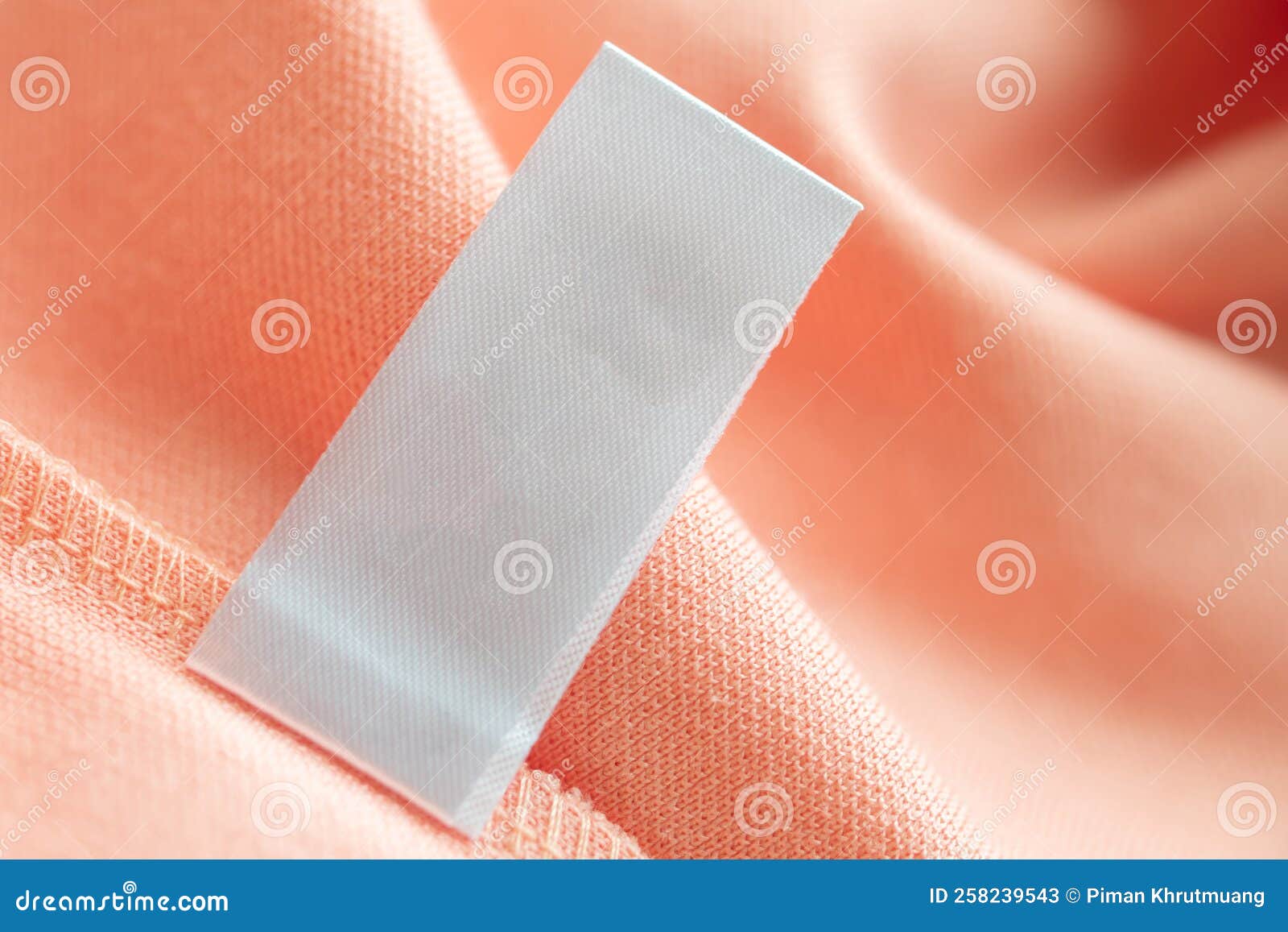 Blank White Laundry Care Clothes Label on Pink Fabric Texture ...