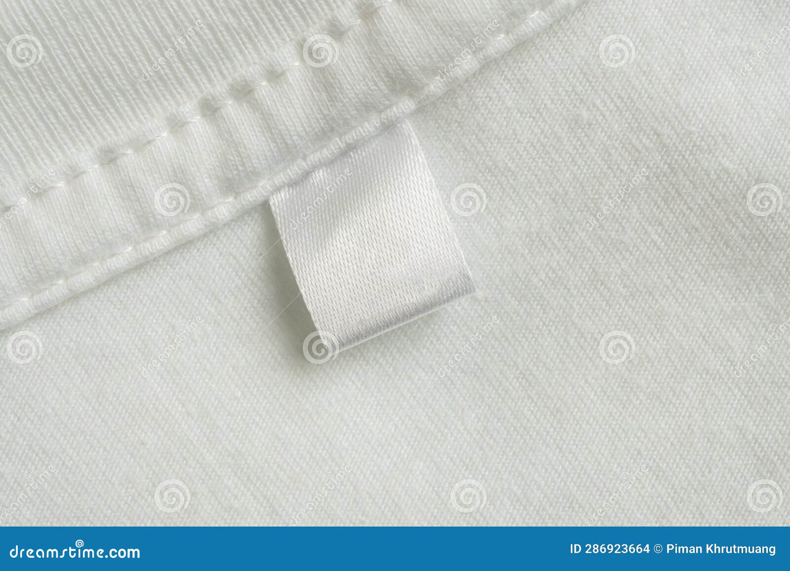 Blank White Laundry Care Clothes Label on White Shirt Fabric Texture ...