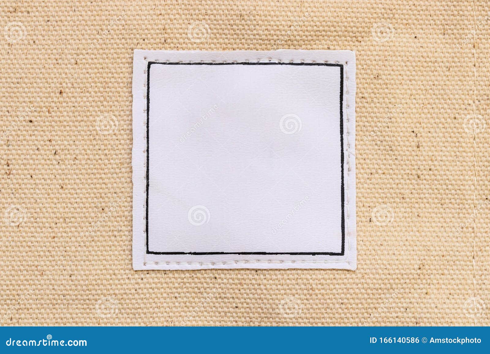 Blank White Leather Label on Brown Canvas Fabric Background Stock Photo ...