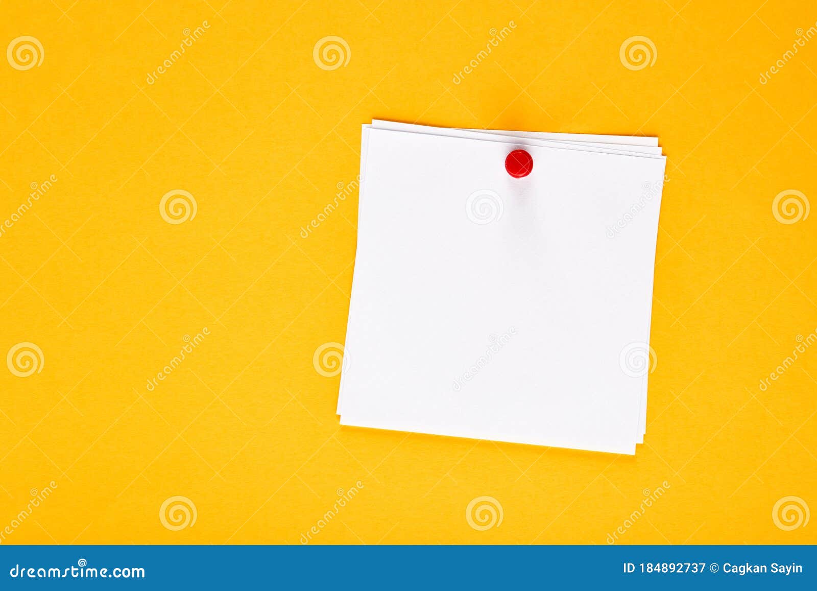 Blank White Note Paper Pinned with a Push Pin on a Yellow Board Stock ...