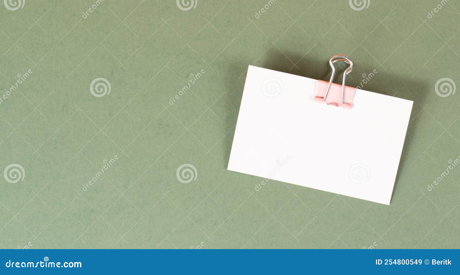 Blank White Paper with a Paperclip on a Green Colored Background, Copy ...
