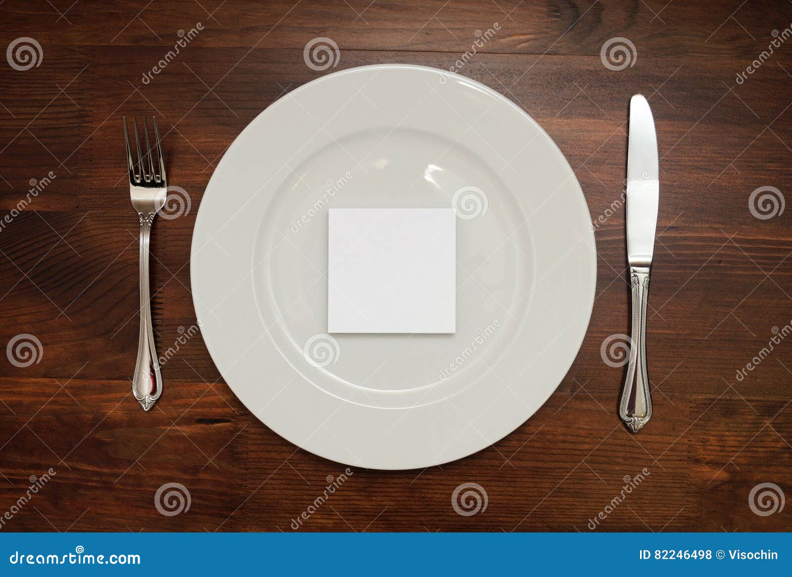 Blank White Piece of Paper on a Plate on a Wooden Table Stock Photo ...