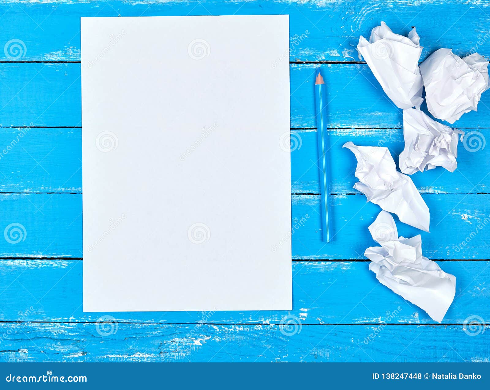 Blank White Rectangular Sheet of Paper and Crumpled Pieces of Paper on ...