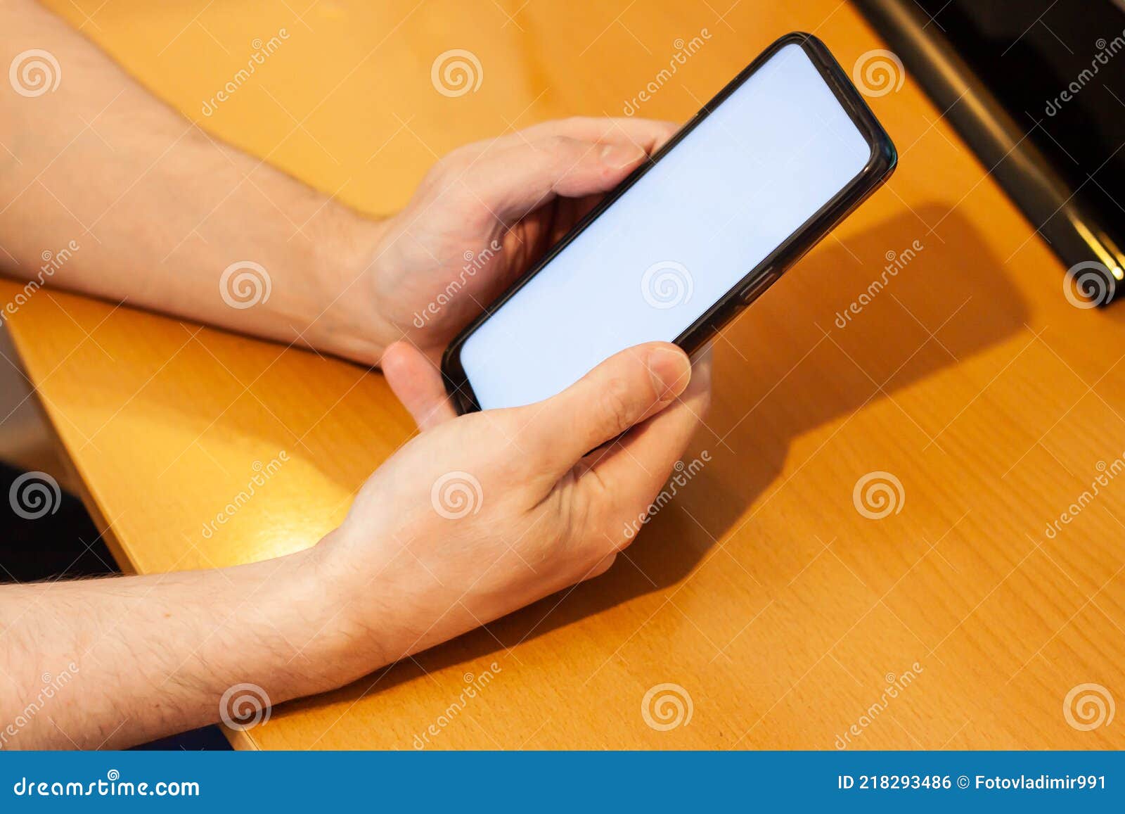Blank White Screen Cell Phone. Male Hand Texting Using a Mobile Phone ...