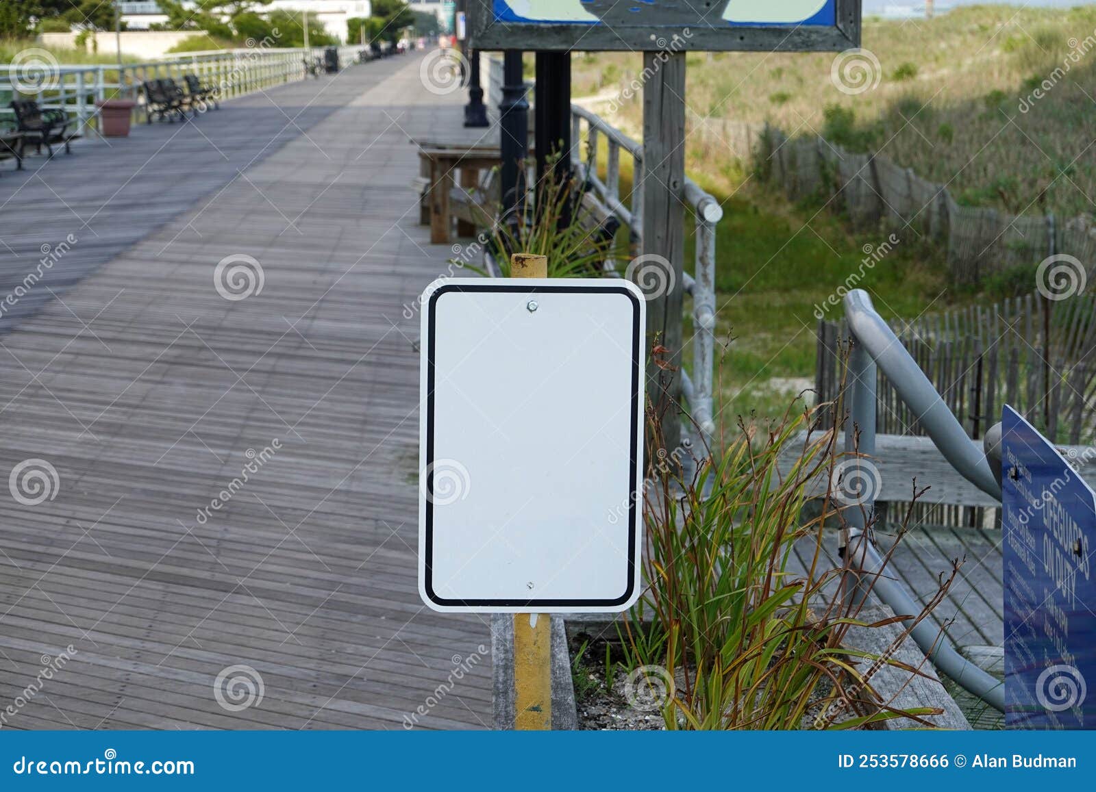 A Blank White Sign with Black Border on a Wooden Boardwalk Stock Photo ...