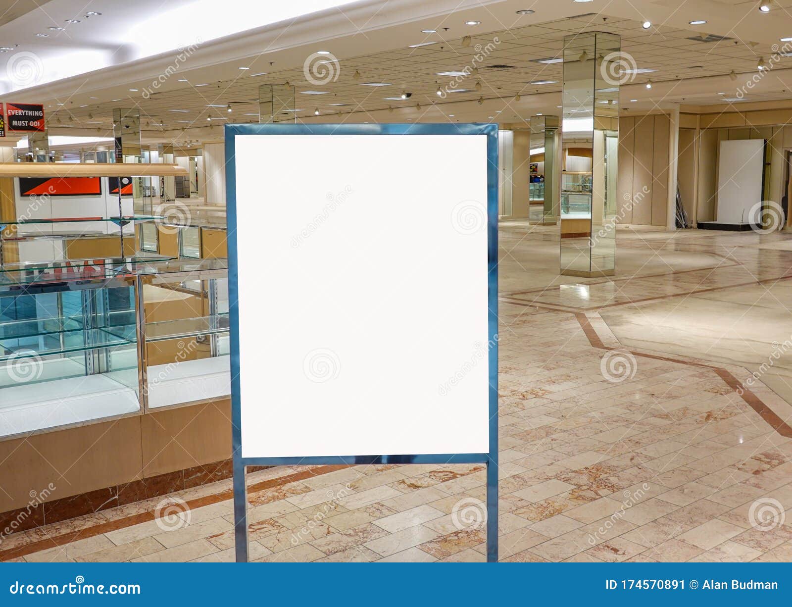 Blank White Sign with Empty Store and Showcases in the Background ...