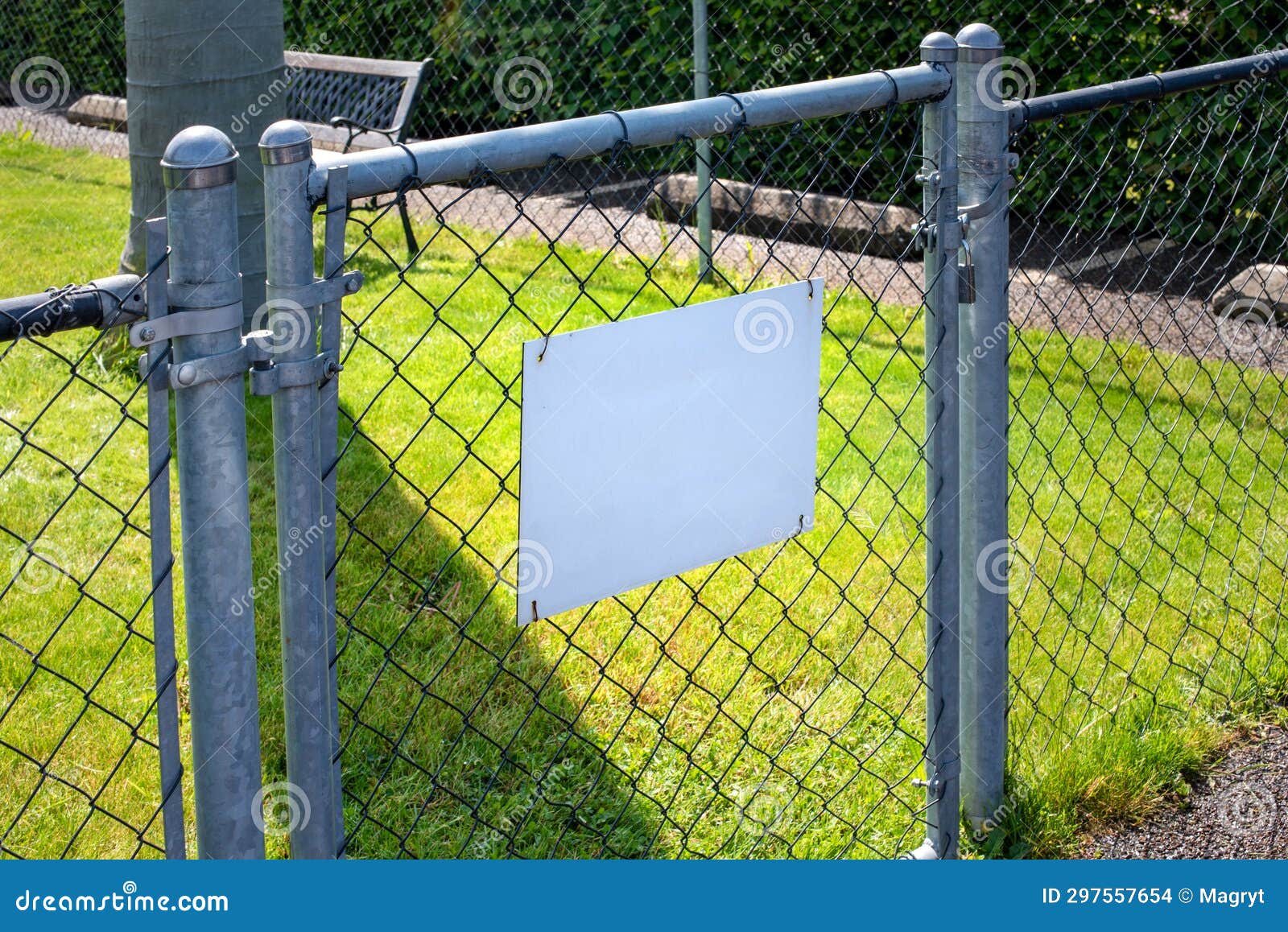 Blank White Signboard on a Chain Link Fence in a Park. Stock Photo ...