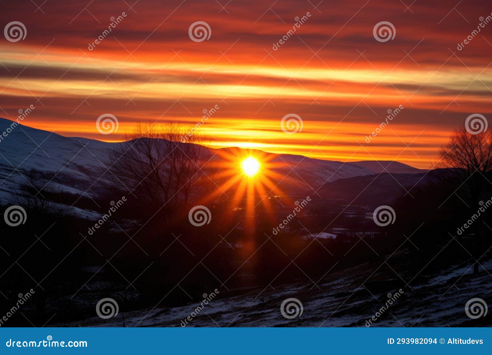 Blazing Winter Solstice Sunset Behind Silhouetted Hills Stock ...