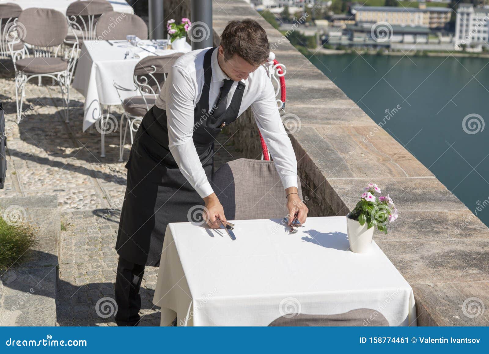 Waiter Sets Table Before Event In Rustic, Boho Style. Catering. Festive ...