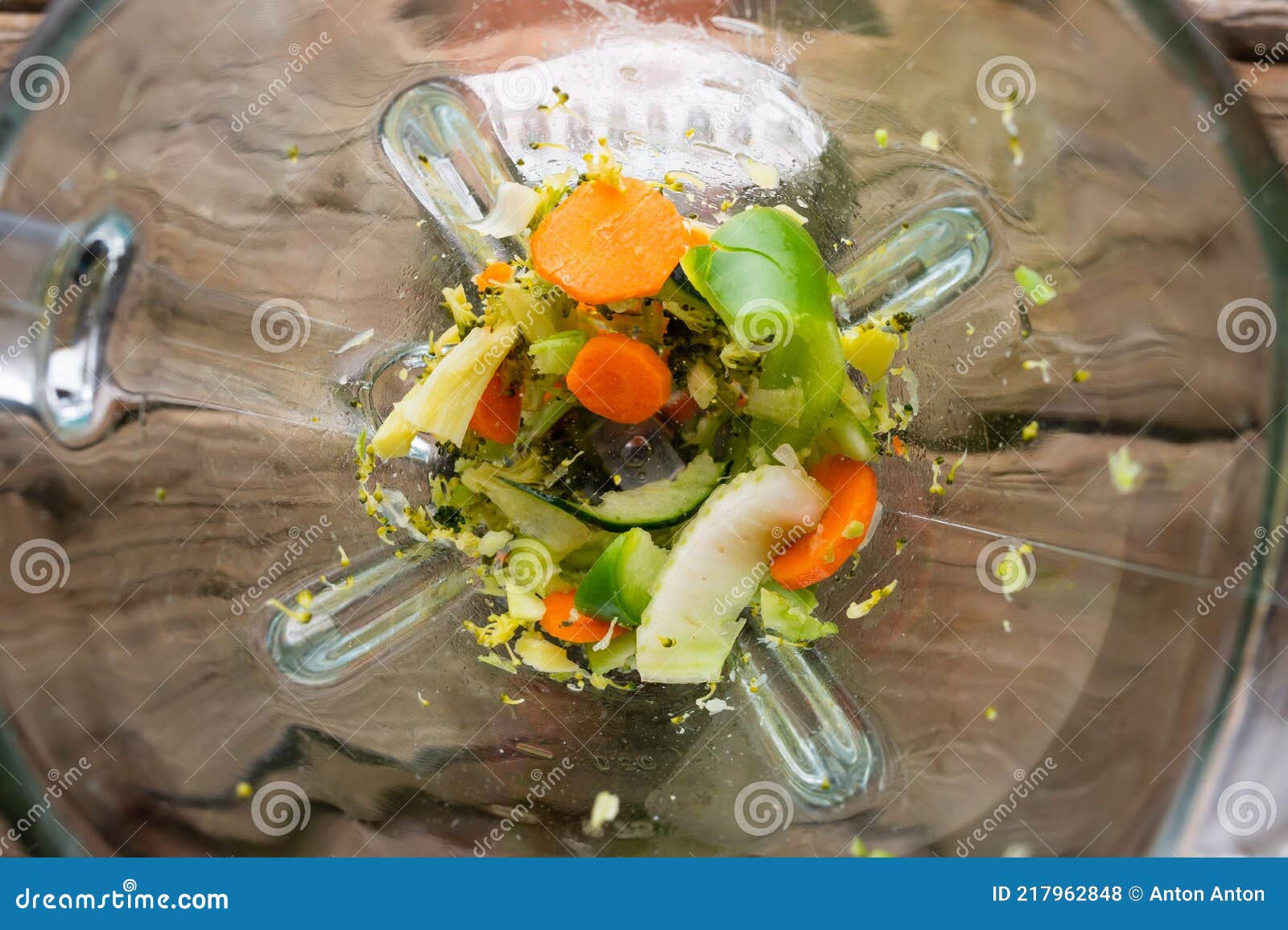 Blender in the Process of Grinding Vegetables on a Wooden Table, Top ...