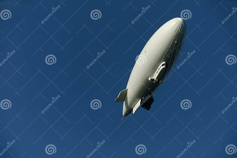 Blimp on Blue stock image. Image of flight, dirigible - 3300909