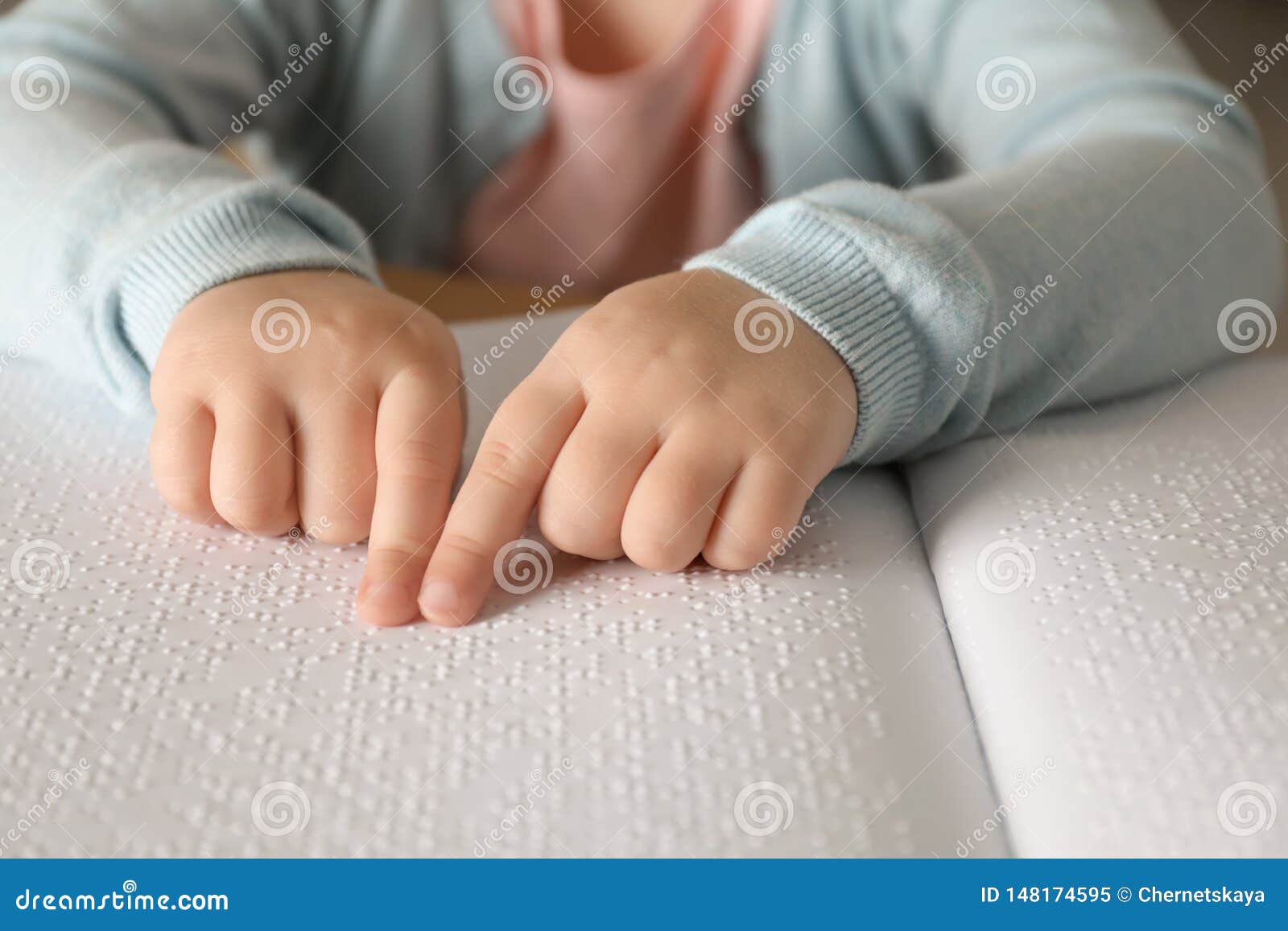 Blind Child Reading Book Written In Braille At Table Royalty-Free Stock ...
