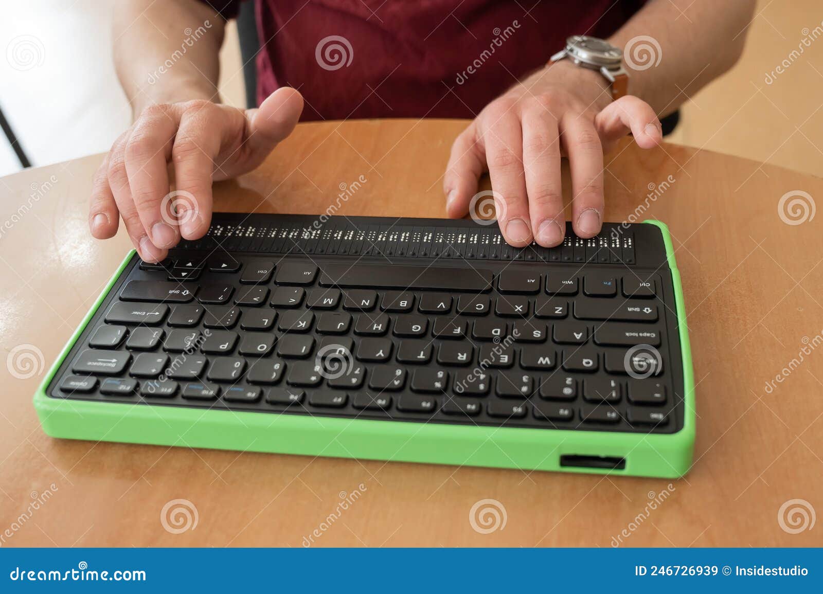 A Blind Man Uses a Computer with a Braille Display and a Computer ...