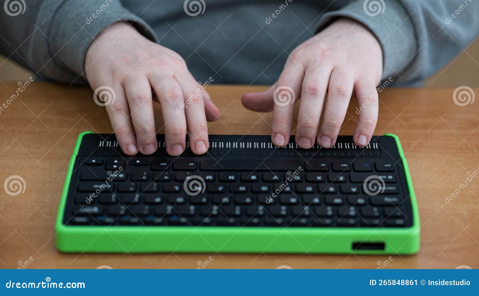 A Blind Man Uses a Computer with a Braille Display and a Computer ...
