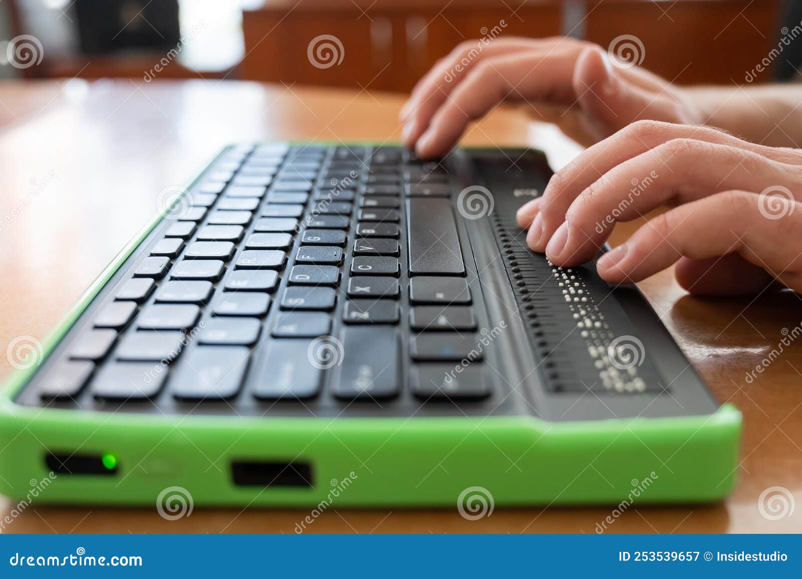 A Blind Man Uses a Computer with a Braille Display and a Computer ...