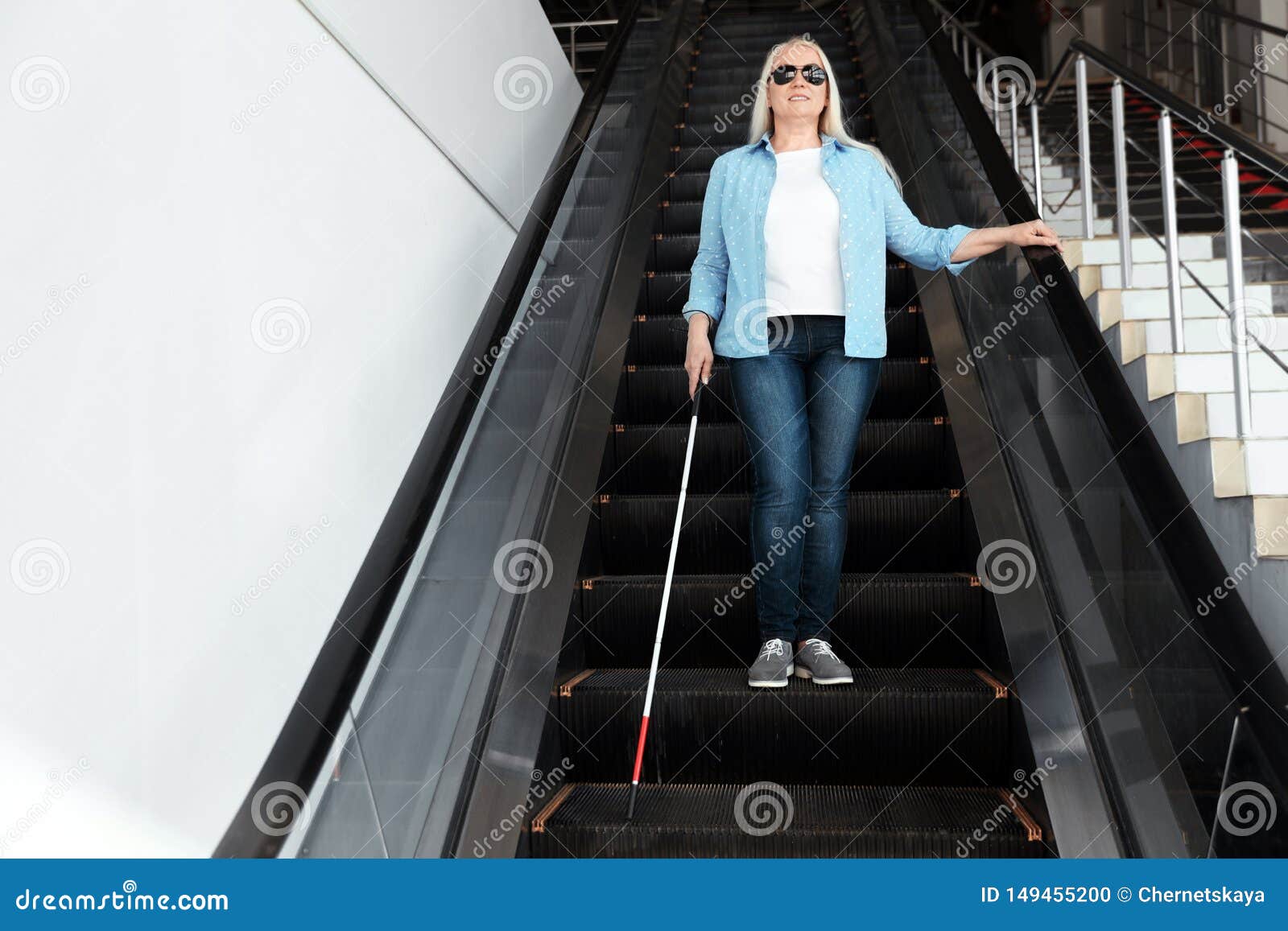 Blind Person with Long Cane on Escalator Stock Photo - Image of ...