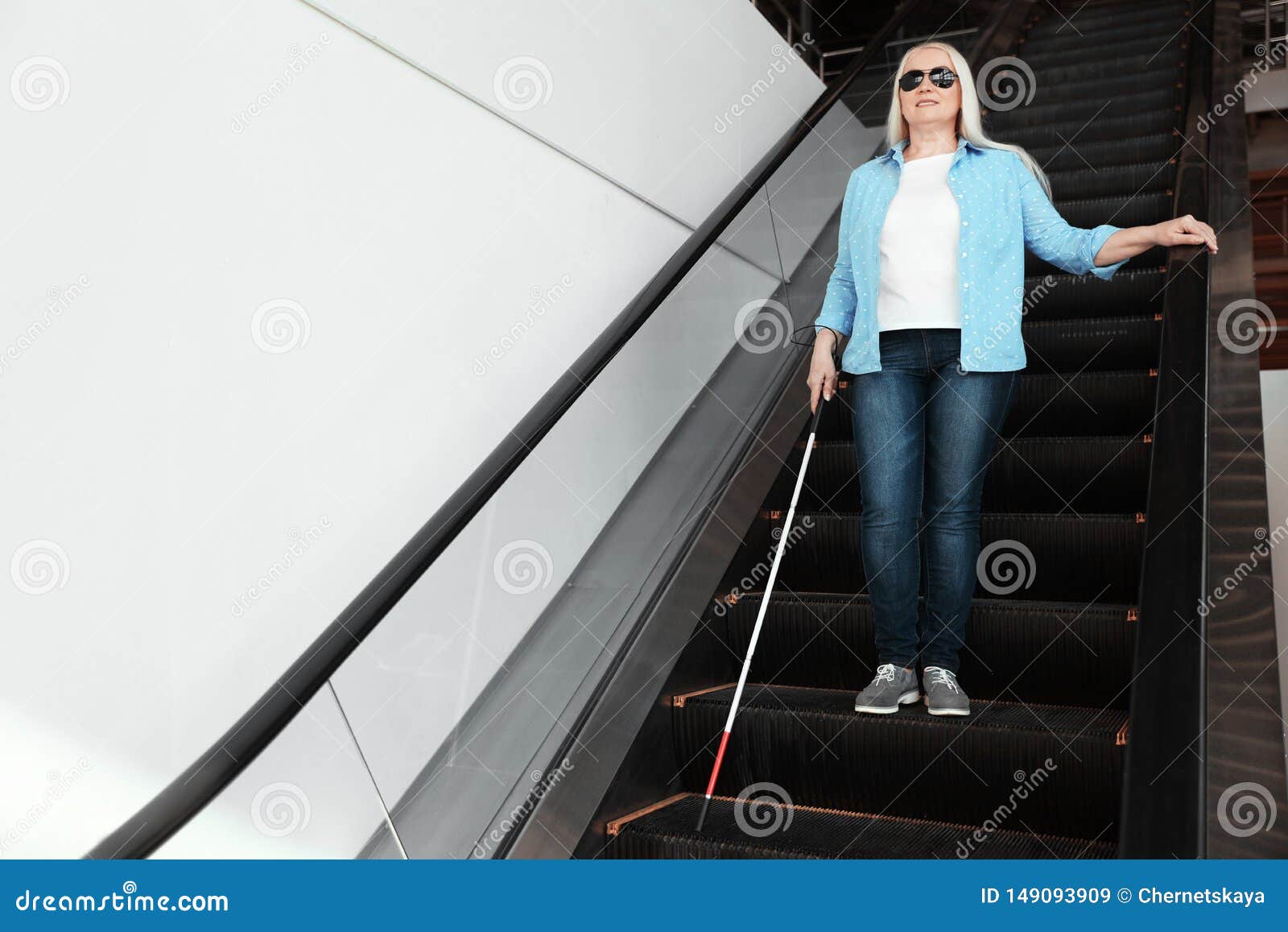 Blind Person with Long Cane on Escalator Indoors Stock Image - Image of ...