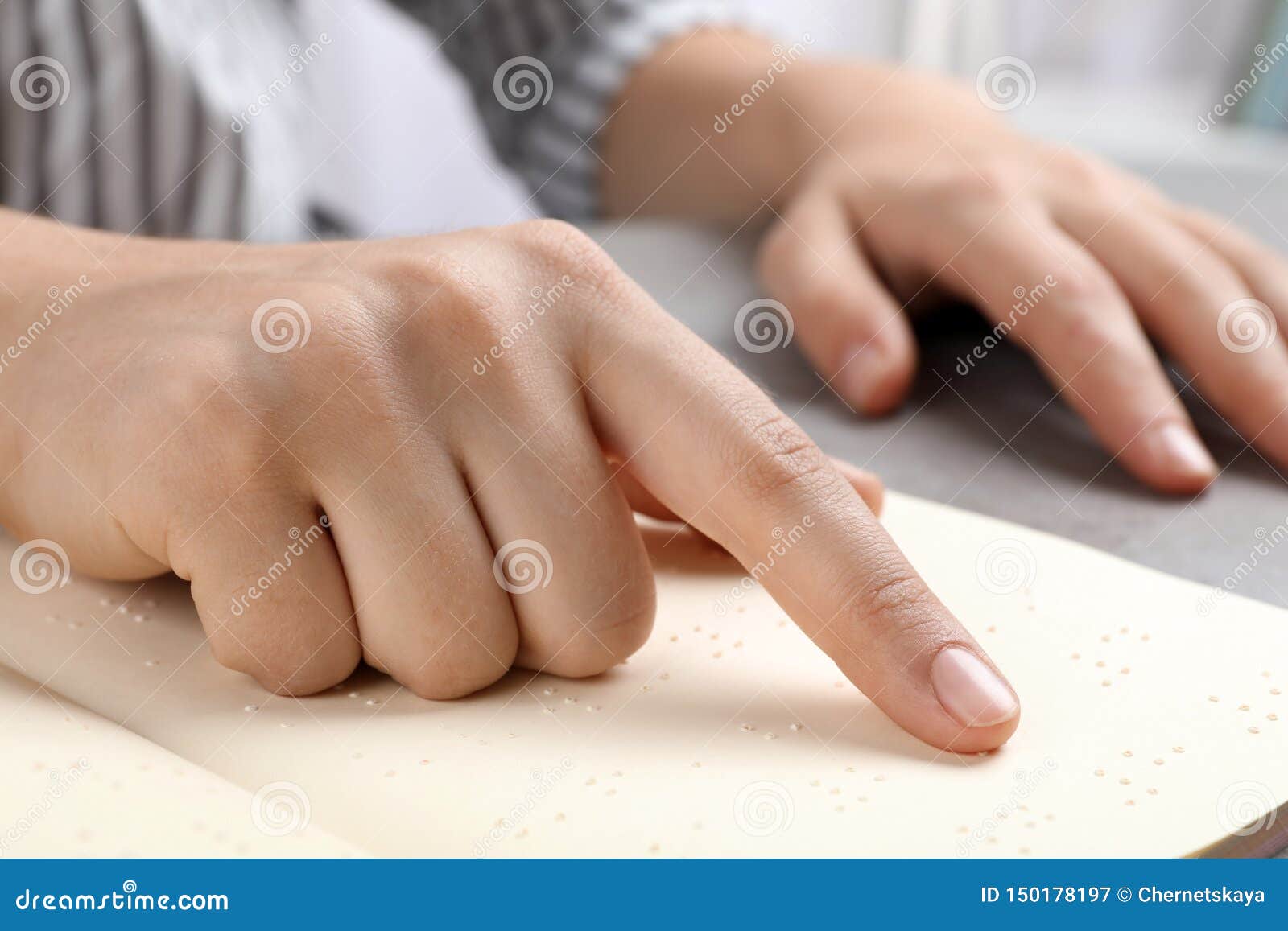 Blind Person Reading Book Written in Braille at Table Stock Image ...