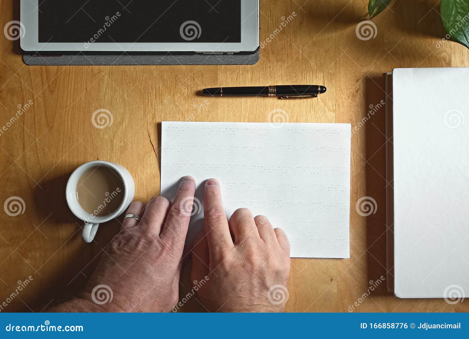 Blind Person Touching Reading a Braille Text on a Desk in a Workplace ...