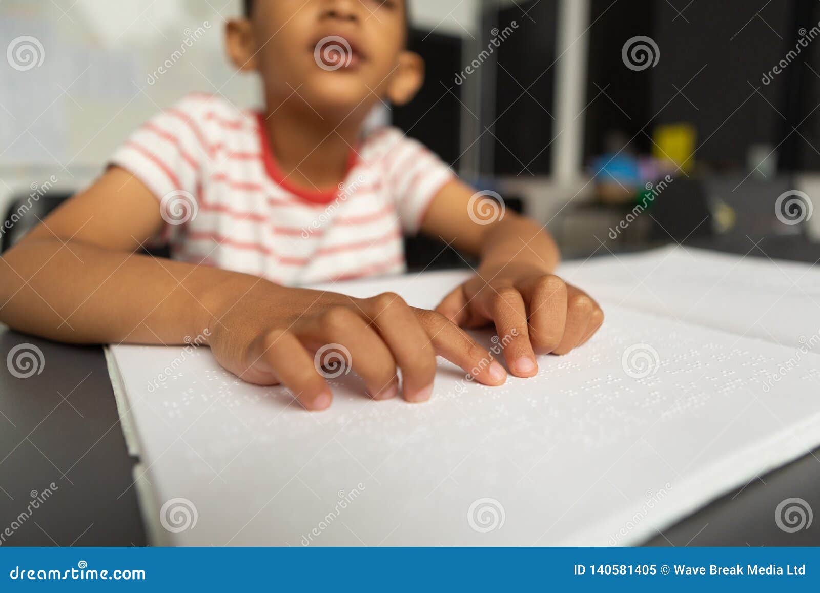 Blind Schoolboy Hands Reading a Braille Book in Classroom Stock Image ...