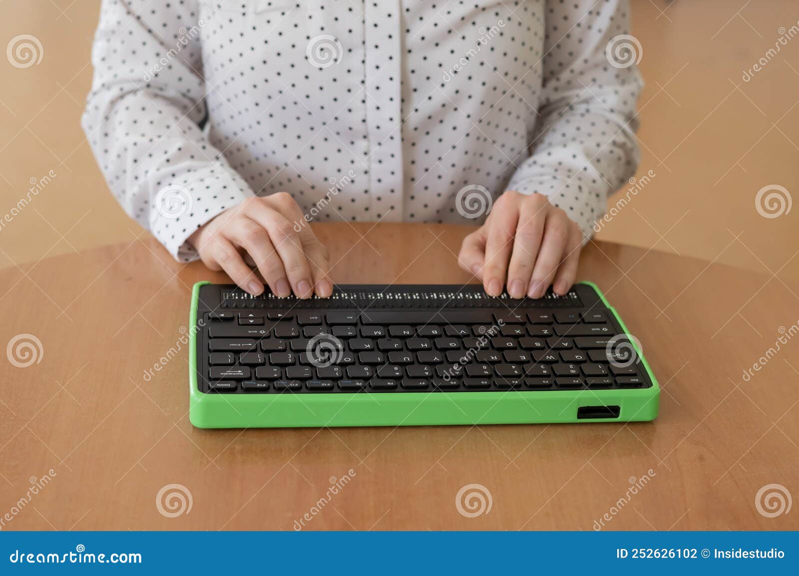 A Blind Woman Uses a Computer with a Braille Display and a Computer ...