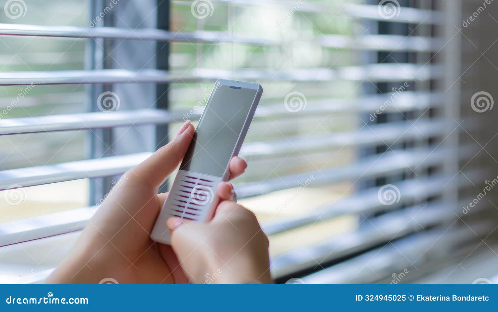 Blinds Being Controlled Using a Smart Remote Control. Stock ...