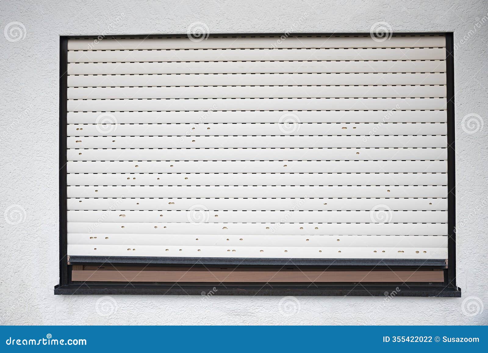 Blinds on the Window Damaged by Hail. Broken Roller Shutter with Holes ...