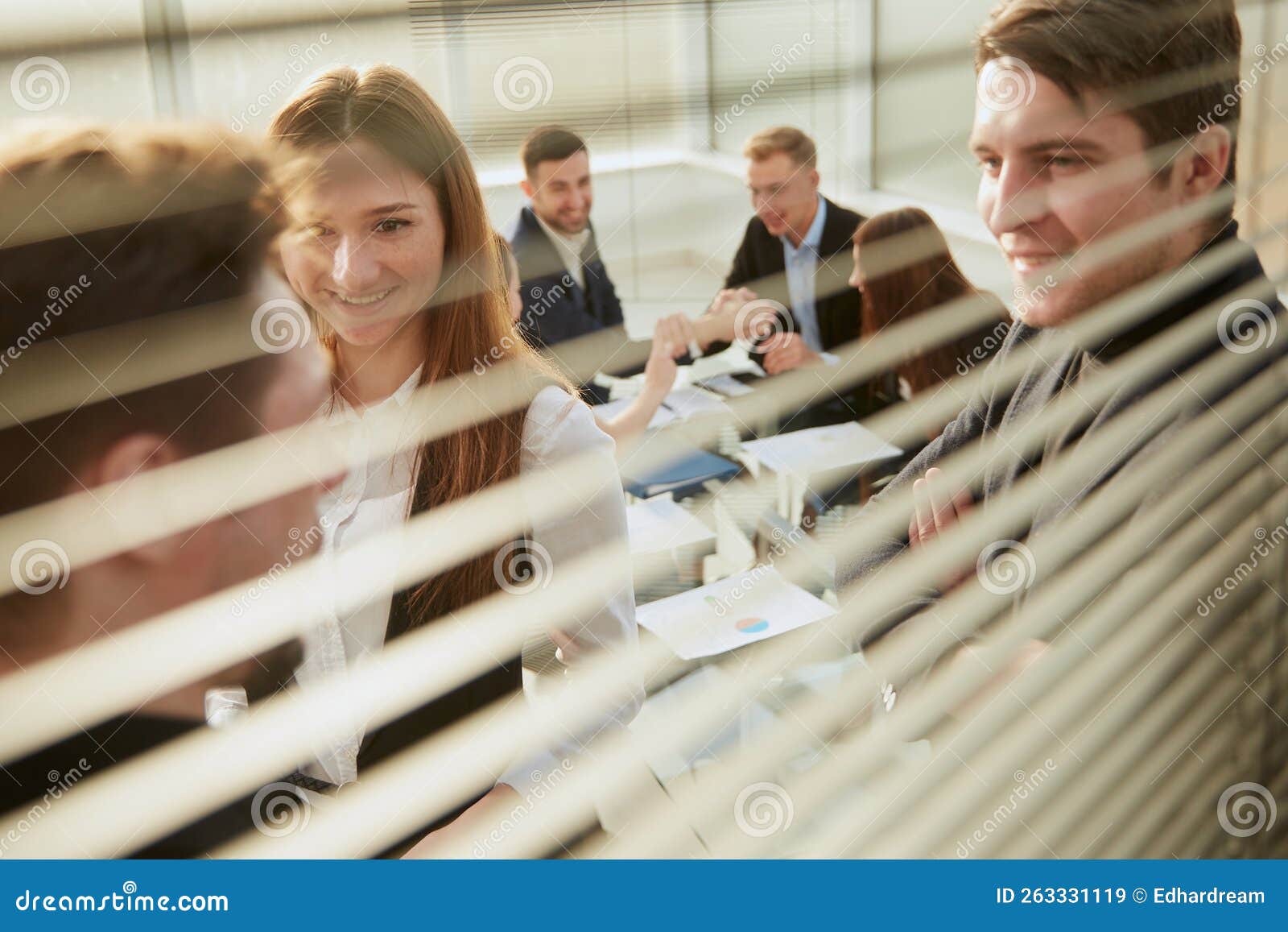 Through the Blinds. Young Employees Work in the Office Stock Image ...
