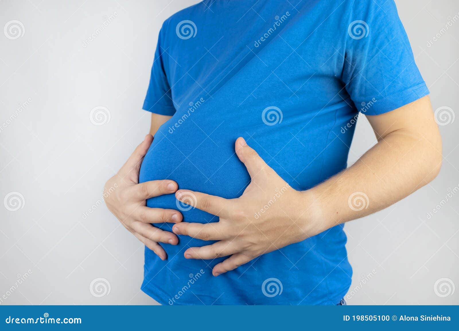 The Man Is Holding Onto His Swollen Belly Bloating Flatulence Gas Malfunction Of The