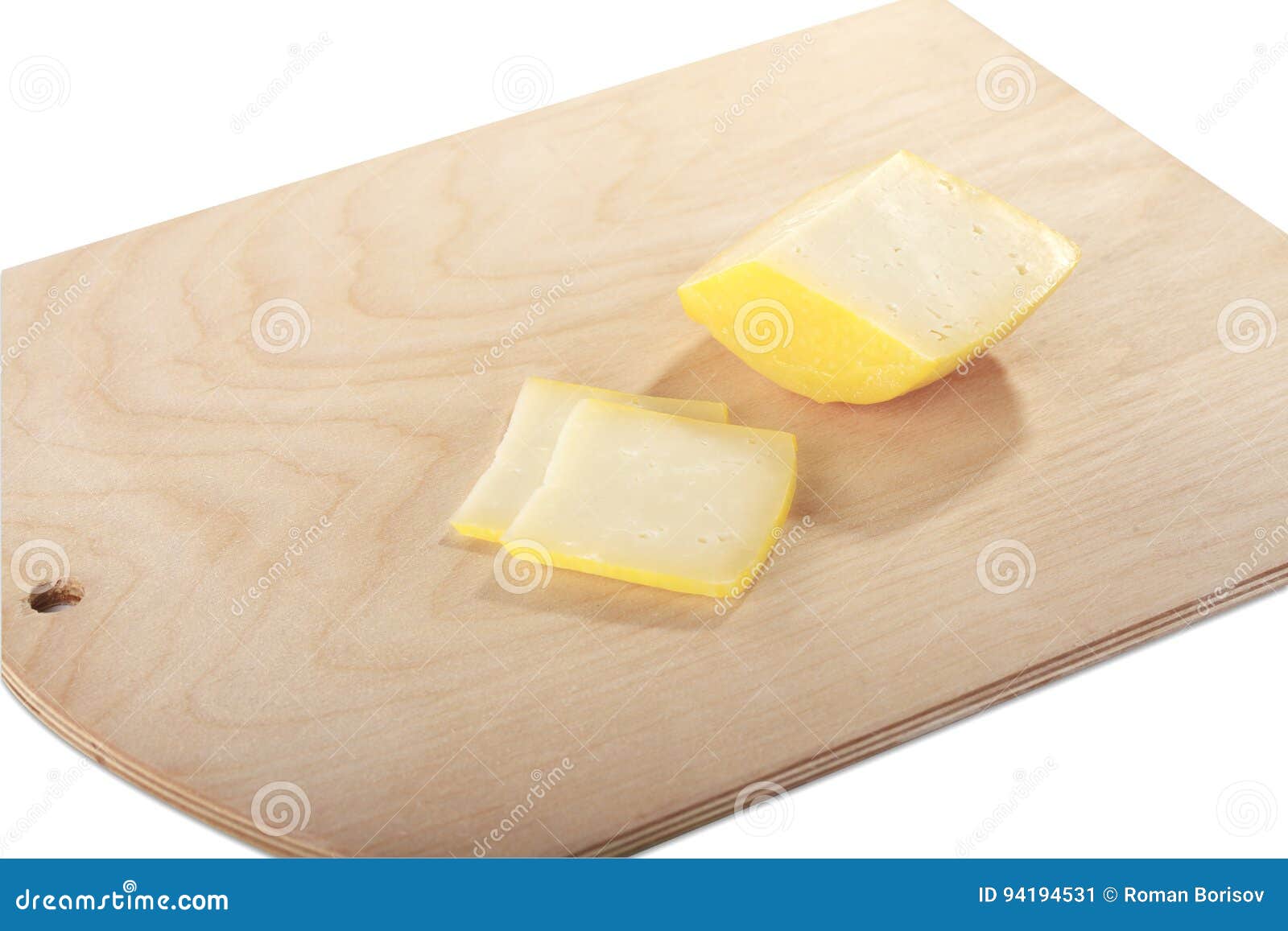 Block of Cheese with Cut Pieces on a Cutting Board, Isolated on White ...