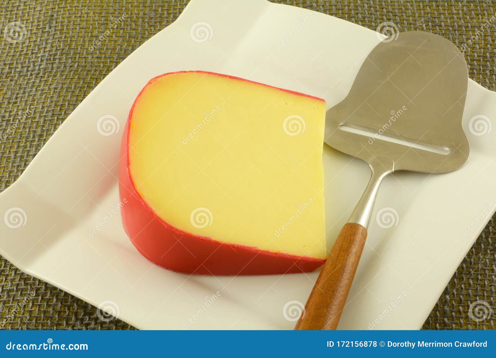 Block of Gouda Cheese on Plate Stock Photo - Image of kitchen, cuisine ...