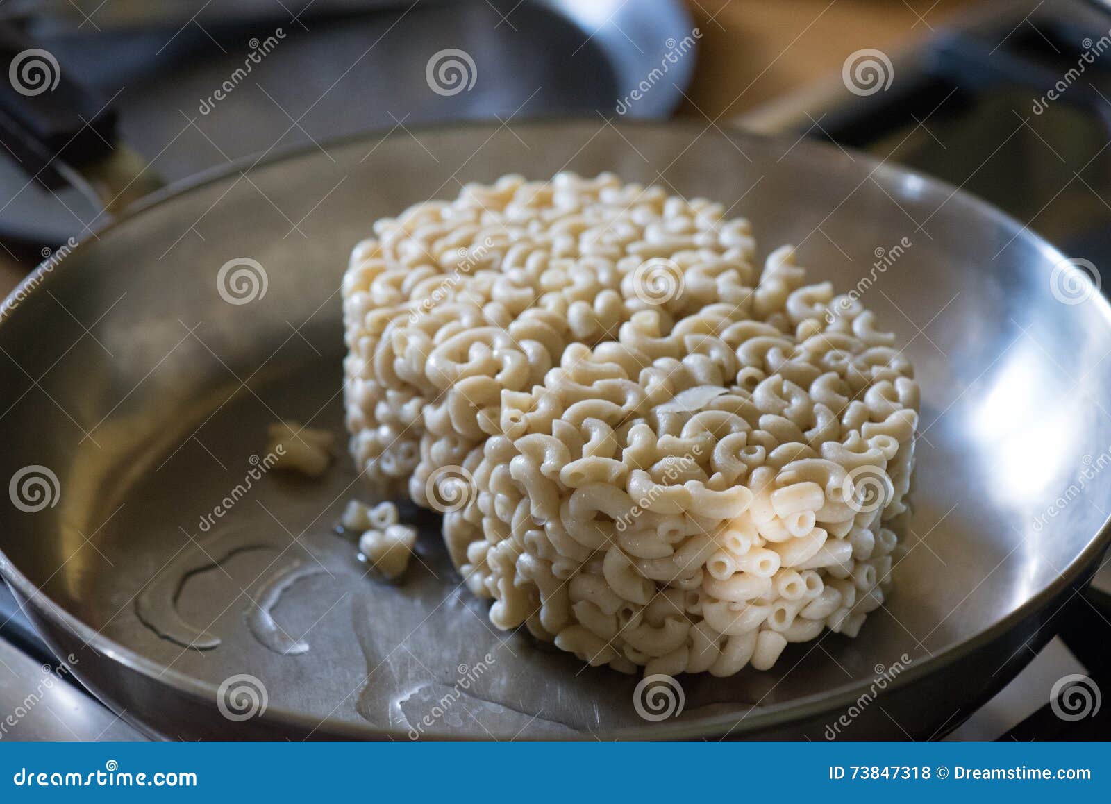 Block of Pasta in a Pan Being Cooked Stock Photo - Image of ...