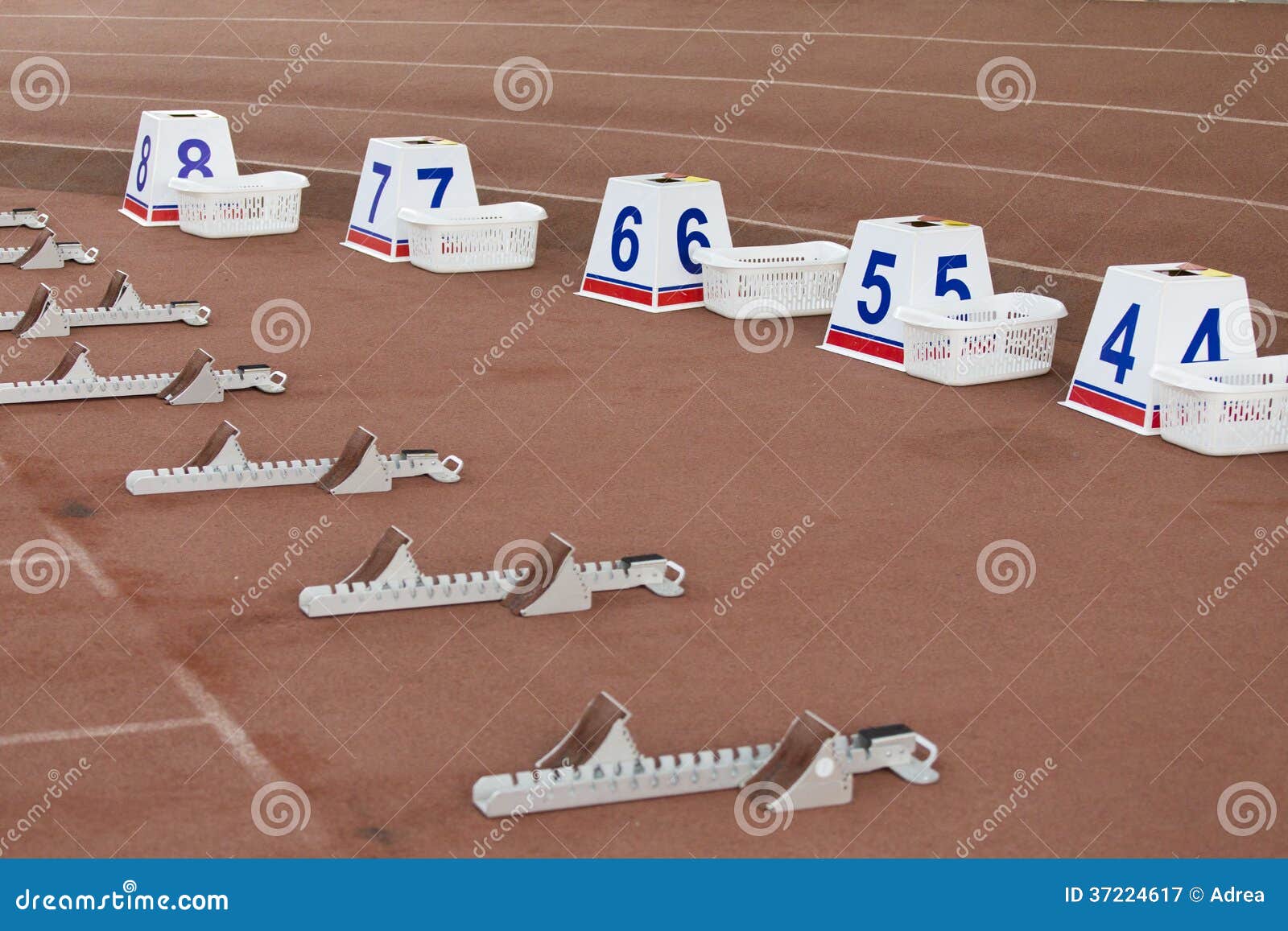 Arranged Starting Blocks, Lane Numbers and Cloth Baskets Stock Image ...