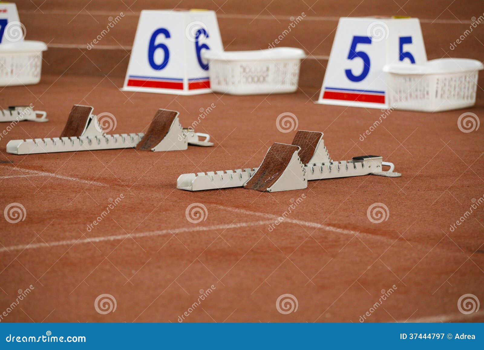 Arranged Starting Blocks, Lane Numbers and Cloth Baskets Stock Image ...