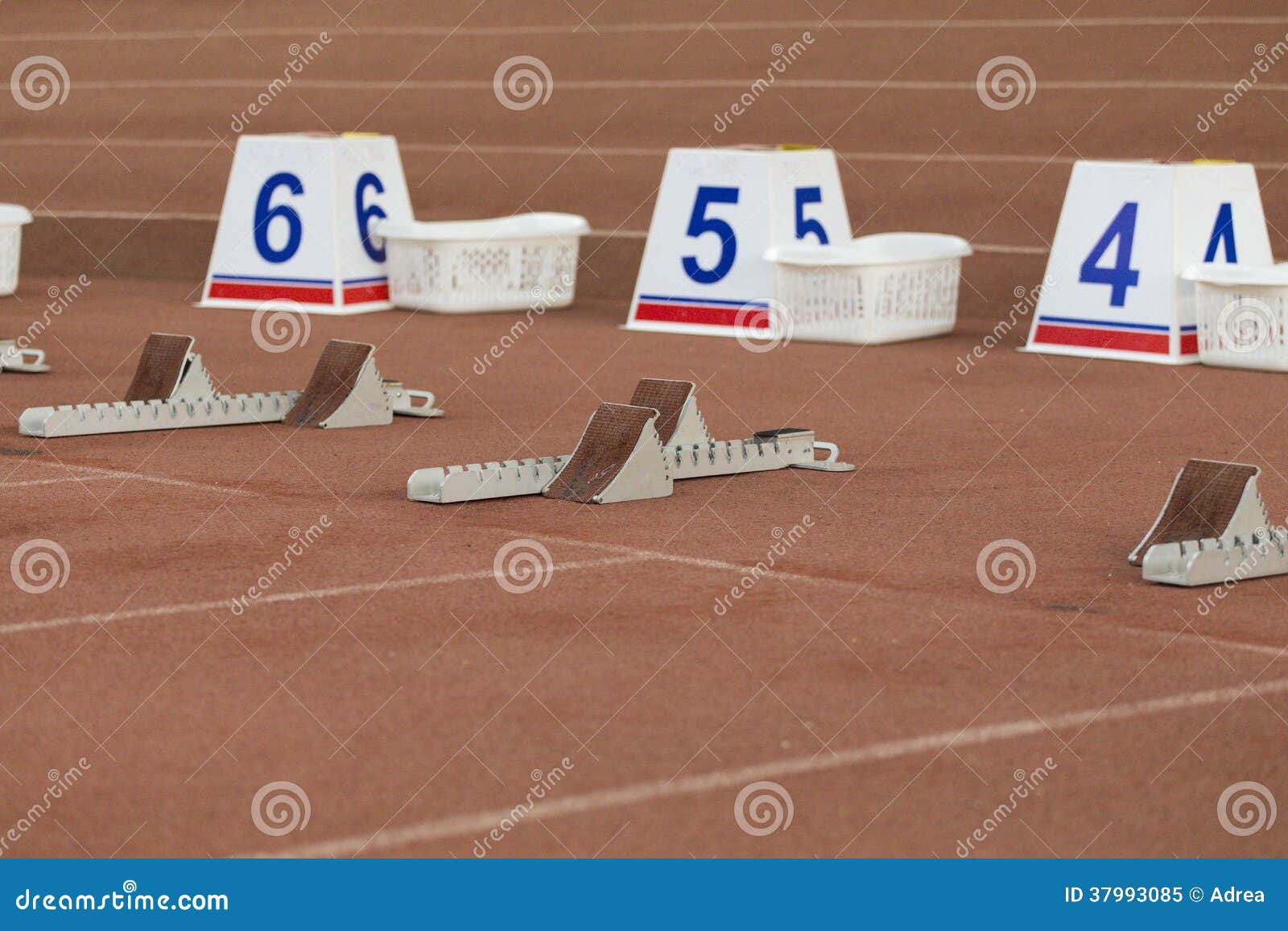 Arranged Starting Blocks, Lane Numbers and Cloth Baskets Stock Image ...