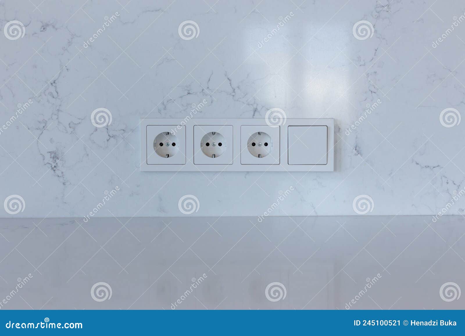 Block of Three Sockets and a Switch on a White Wall Stock Image - Image ...