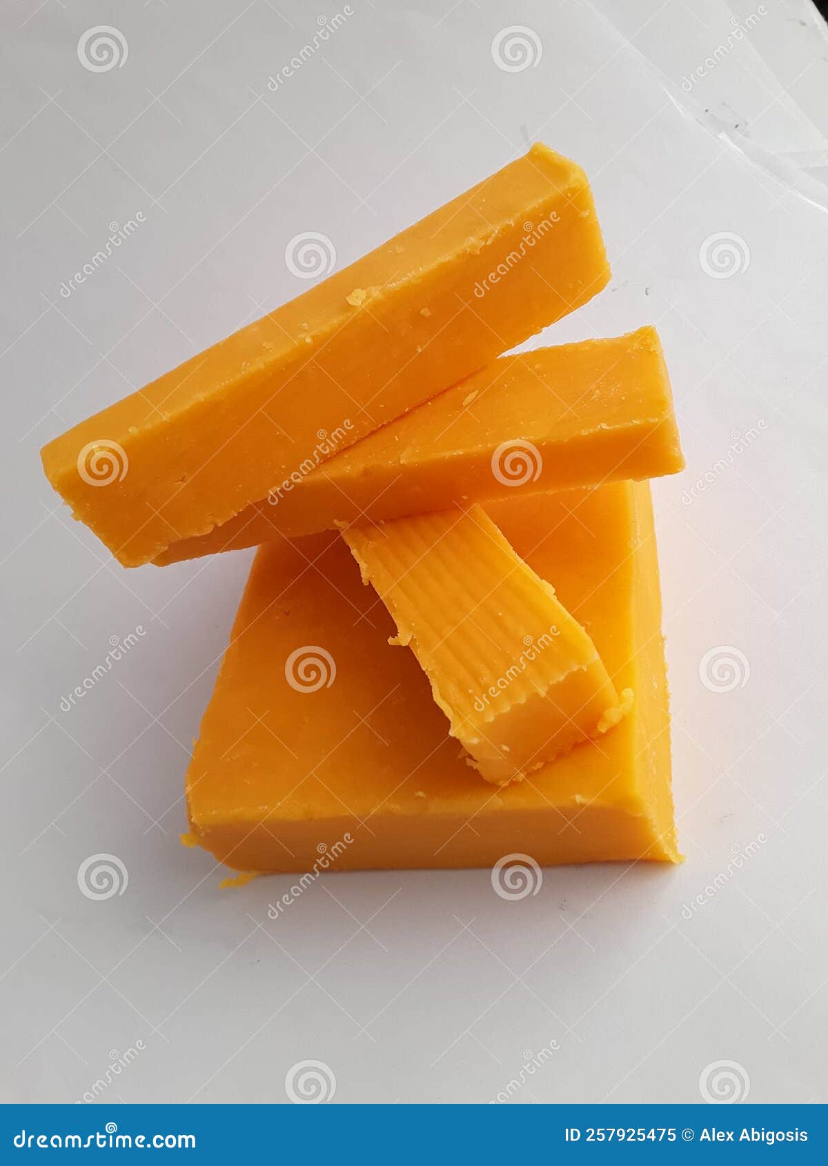 Blocks of Orange Cheddar Cheese Isolated on a White Background Stock ...