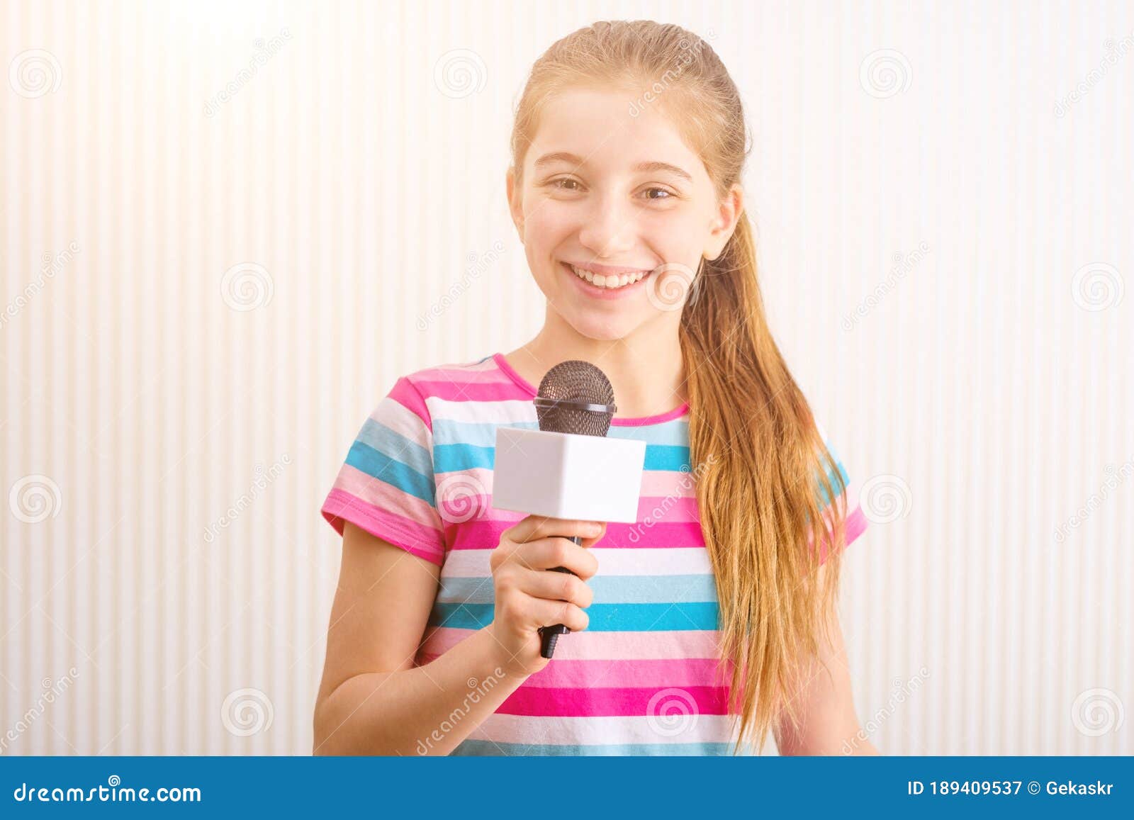 Blogger girl with mic stock image. Image of musician - 189409537