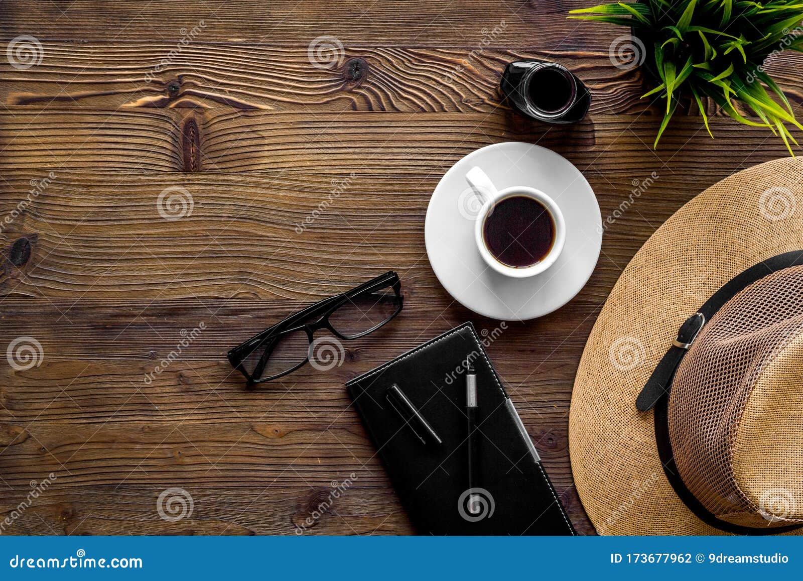 Blogger`s Work Desk with Hat and Notebook on Dark Wooden Background Top ...