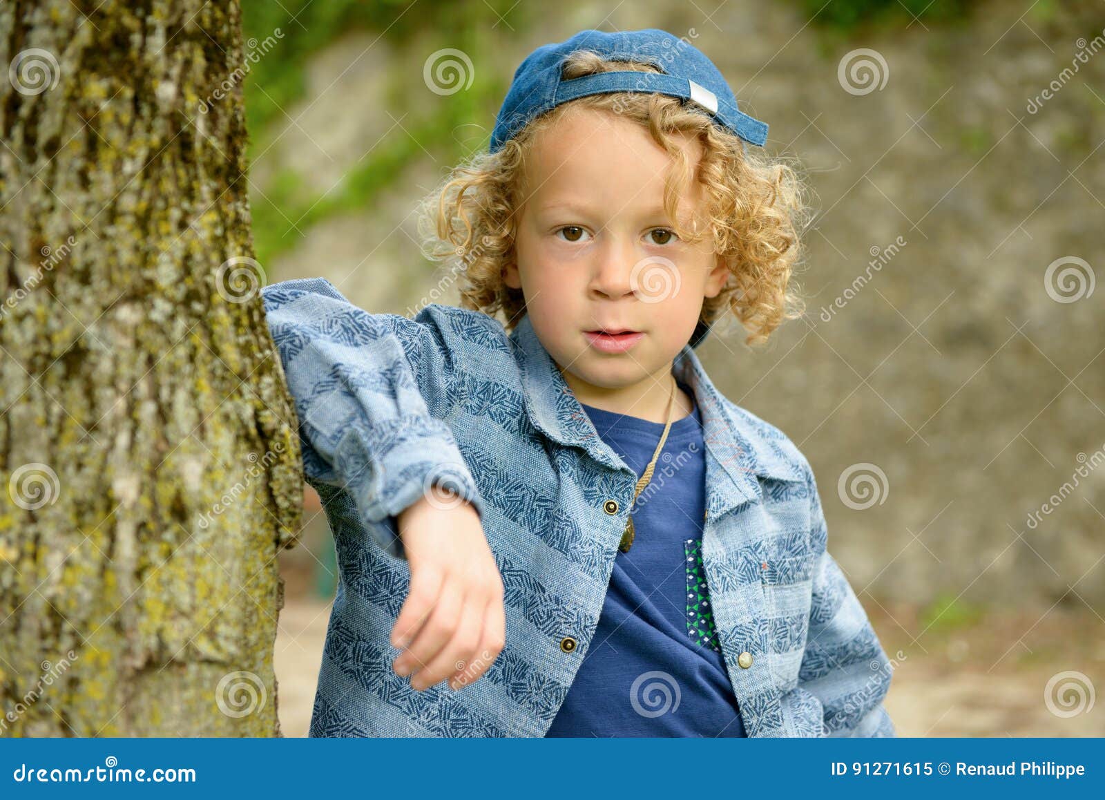 Blond boy with a blue cap stock image. Image of handsome - 91271615
