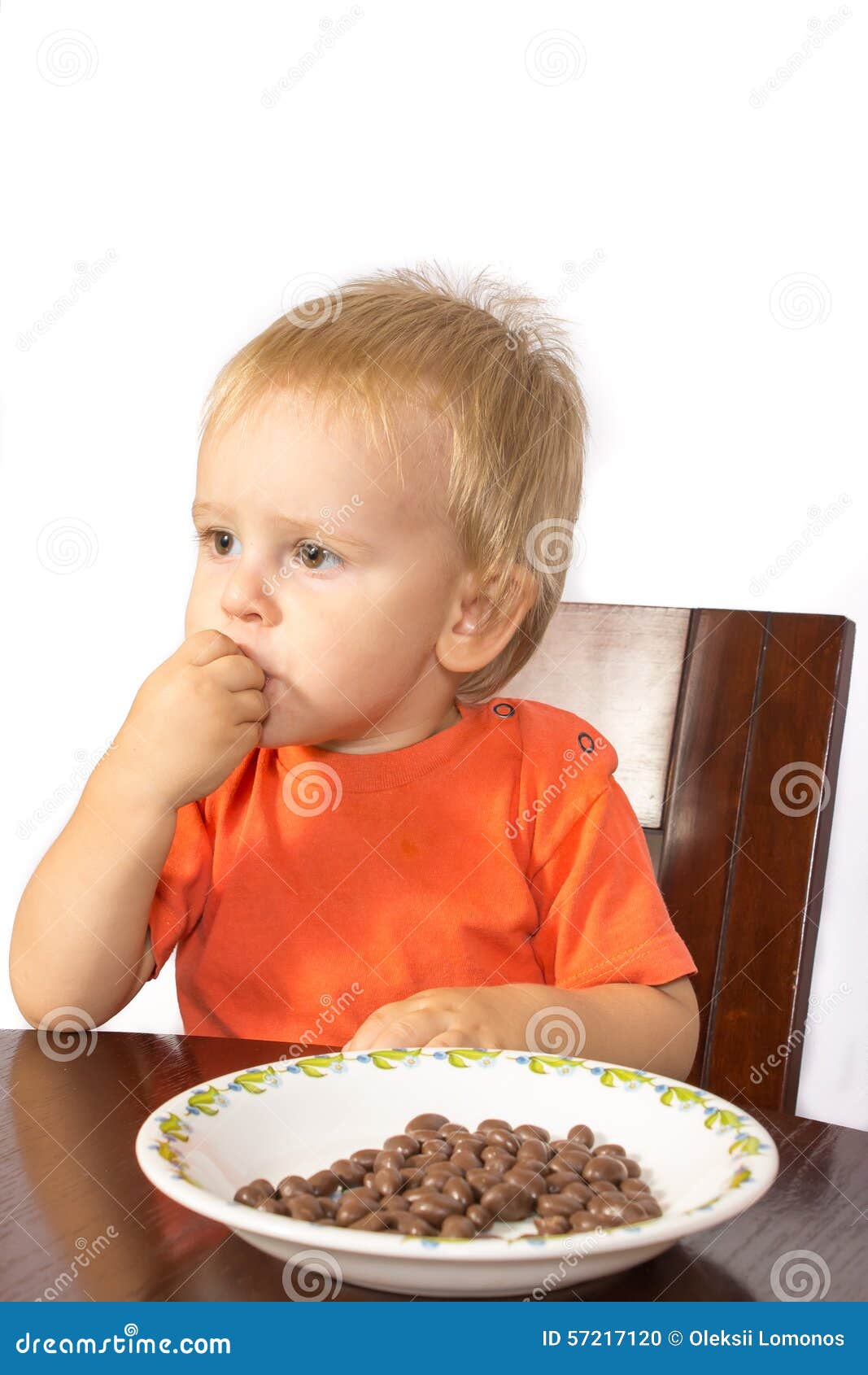 Blond Boy Greedily Eats Nuts Stock Photo - Image of hungry, happy: 57217120