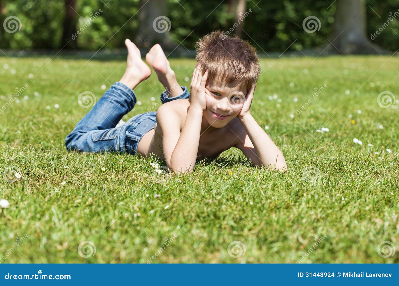 Blond Boy Lying On Grass Stock Images - Image: 31448924