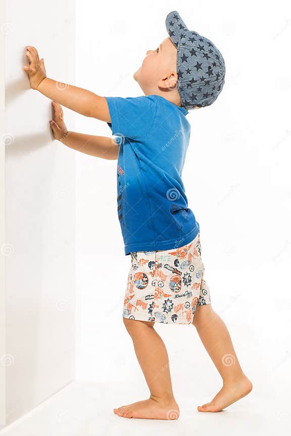 Blond Boy Pushing he Wall White Bacground Stock Image - Image of ...