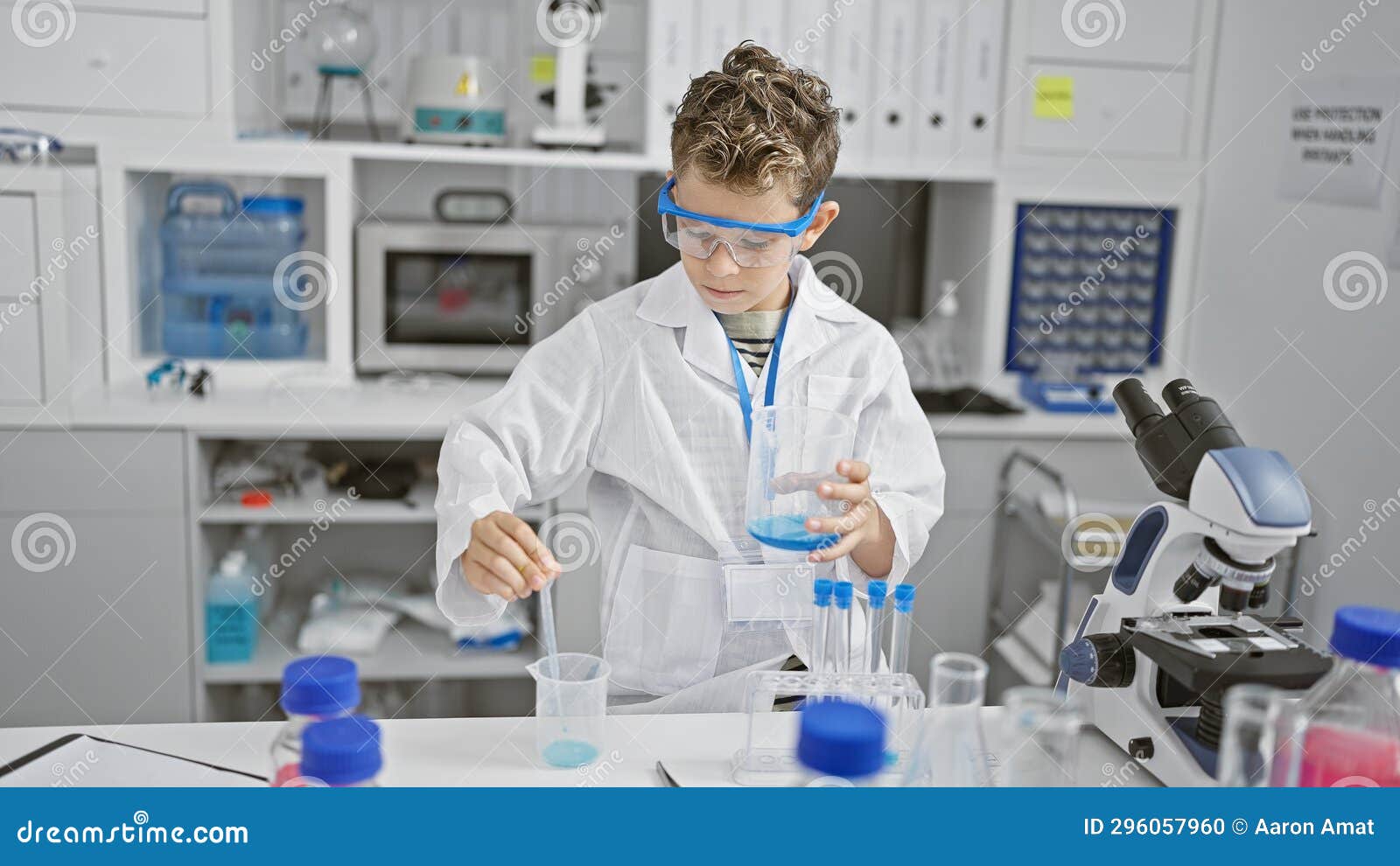 Blond Boy Scientist Doing Experiment at Laboratory Stock Photo - Image ...