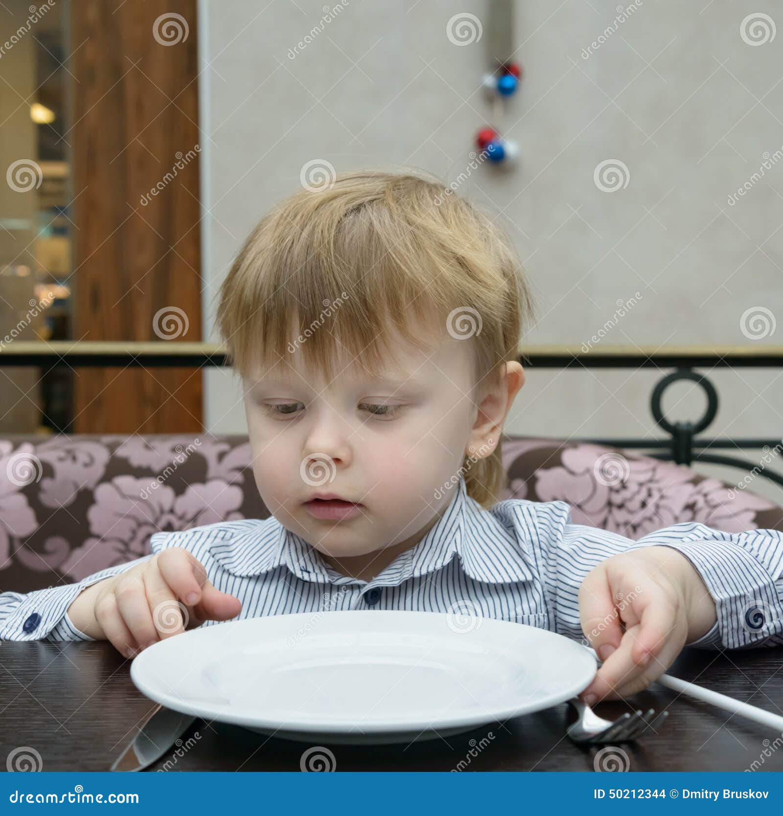 Blond Boy Sitting at a Table with an Empty Plate Stock Photo - Image of ...