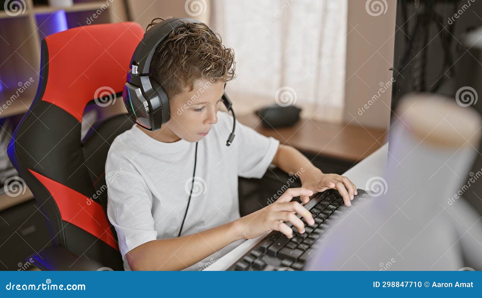 Blond Boy Streamer Playing Video Game Using Computer at Gaming Room ...
