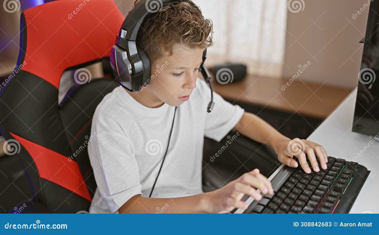 Blond Boy Streamer Playing Video Game Using Computer at Gaming Room ...